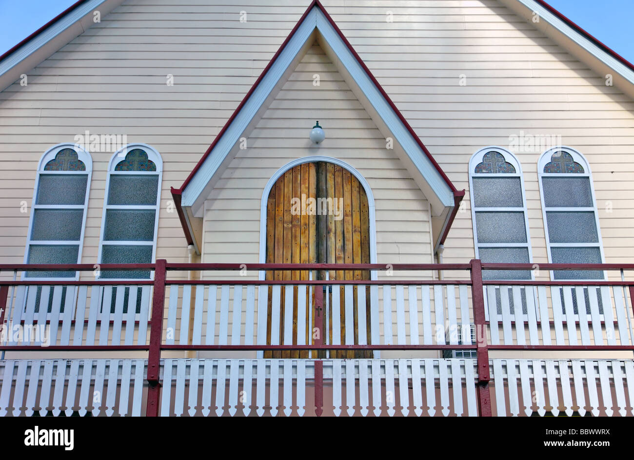 Closed wooden door with arch and a balcony leading into a church Stock ...