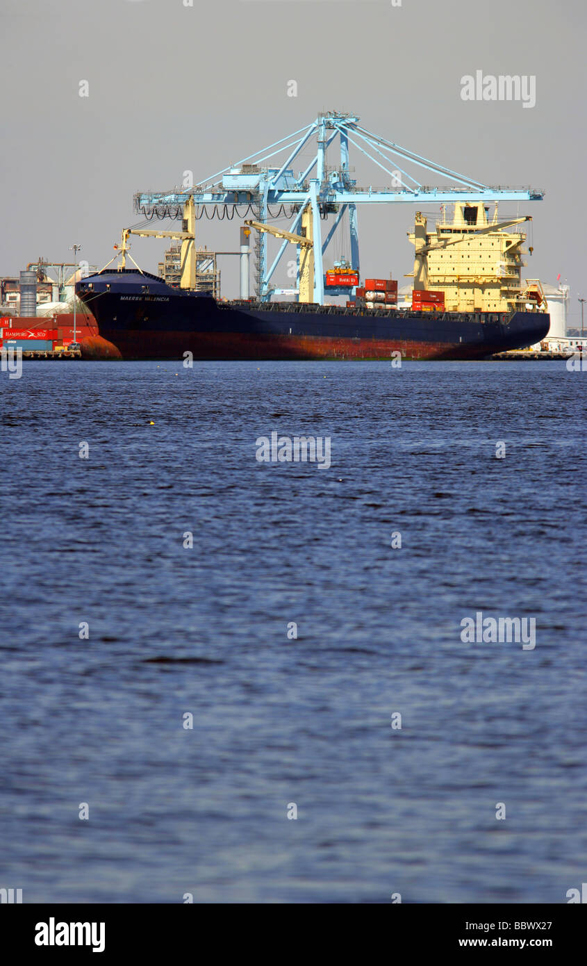 Loading containerships in port Stock Photo - Alamy