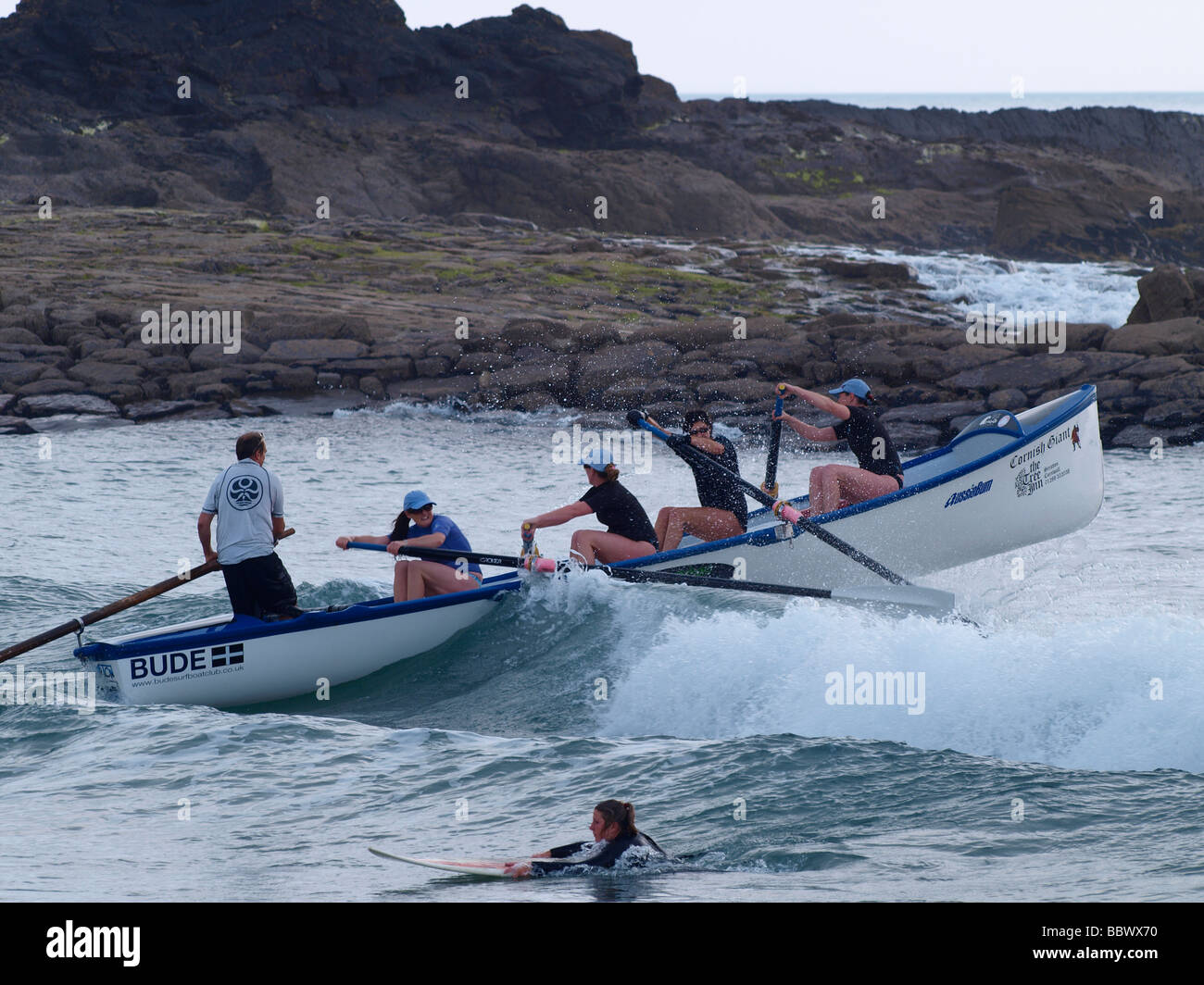 Gig boat team battling through waves Stock Photo - Alamy