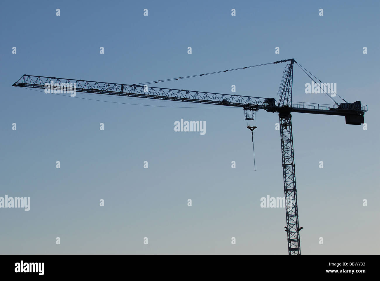 Backlit construction crane at dusk Stock Photo - Alamy