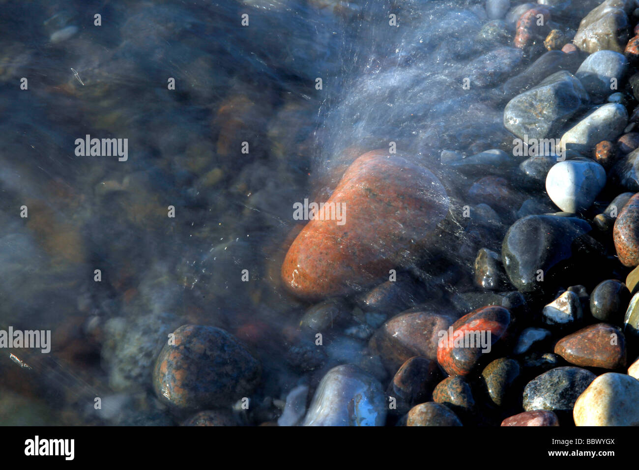 Water flowing over rocks in the Baltic Sea, Heiligenhafen, Schleswig ...