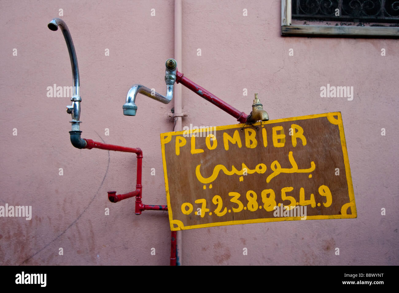 Plumber Advertisement in Marrakesh Morocco Stock Photo - Alamy