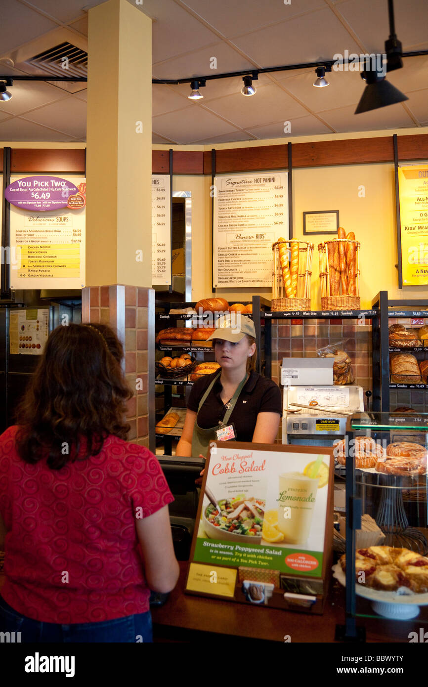 woman ordering food at Panera restaurant cafe in shopping mall, USA ...