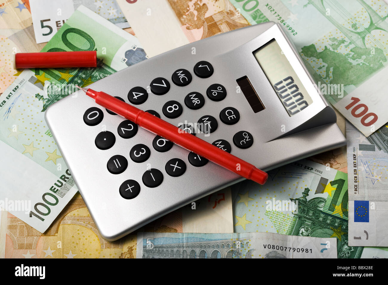 money concept - silver colored calculator on european currency notes ...
