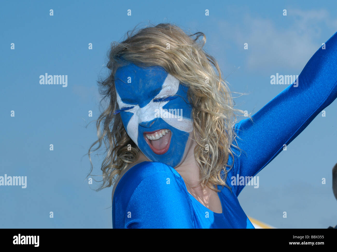 A young woman, face painted with the Scottish Flag Stock Photo - Alamy