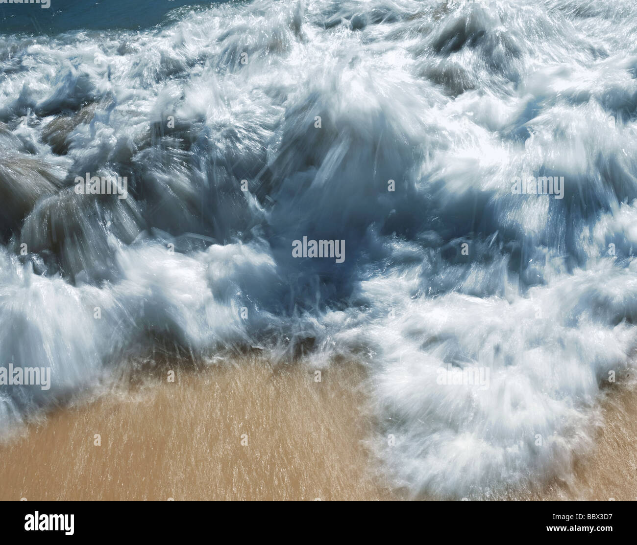 Heavy waves rolling onto a beach Spain Stock Photo - Alamy