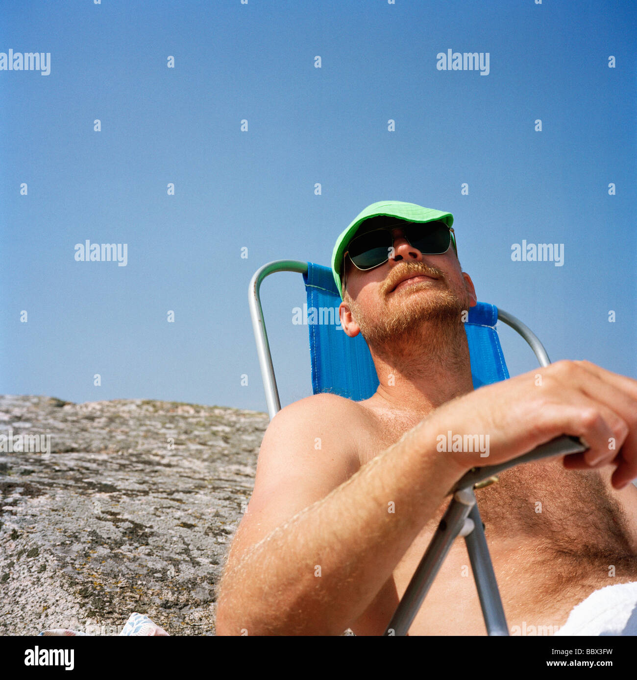 A Man In A Sun Chair Sweden Stock Photo Alamy A Man In A Sun Chair Sweden Stock Photo Alamy