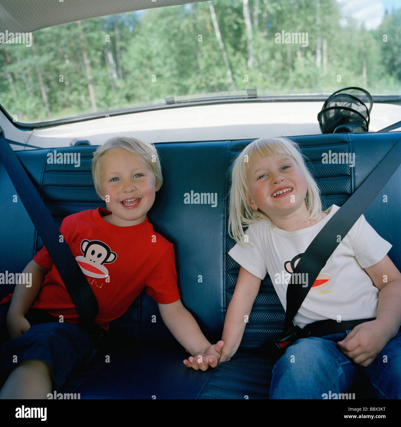 Two children in the back seat Sweden Stock Photo - Alamy