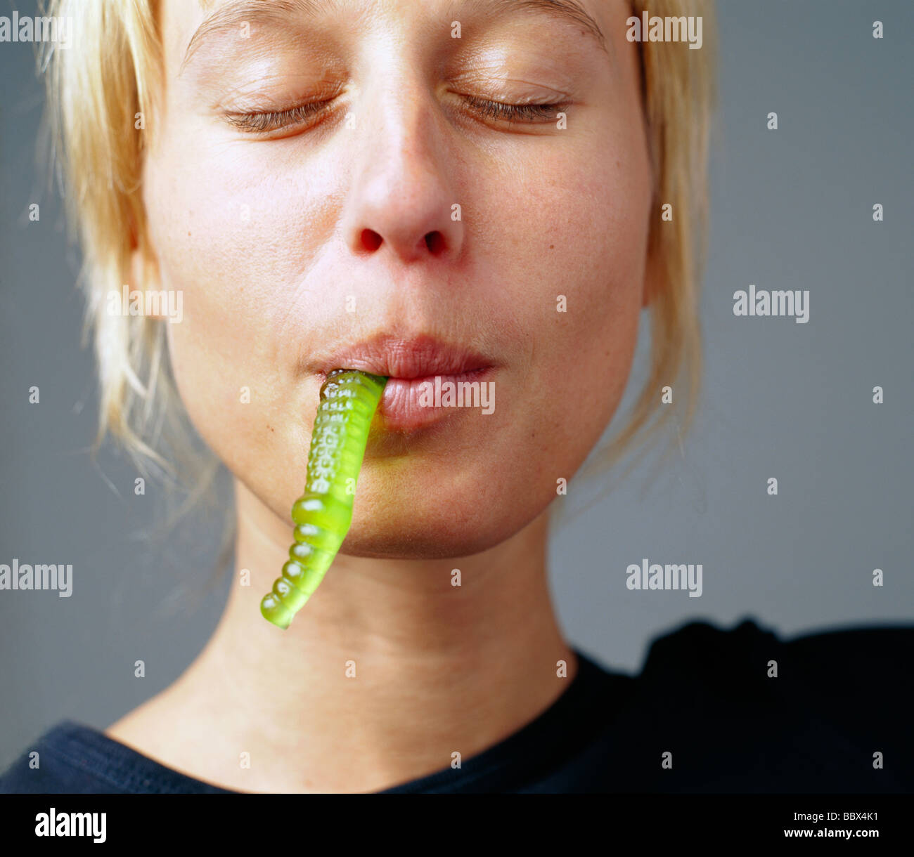 A woman eating candy Sweden Stock Photo - Alamy