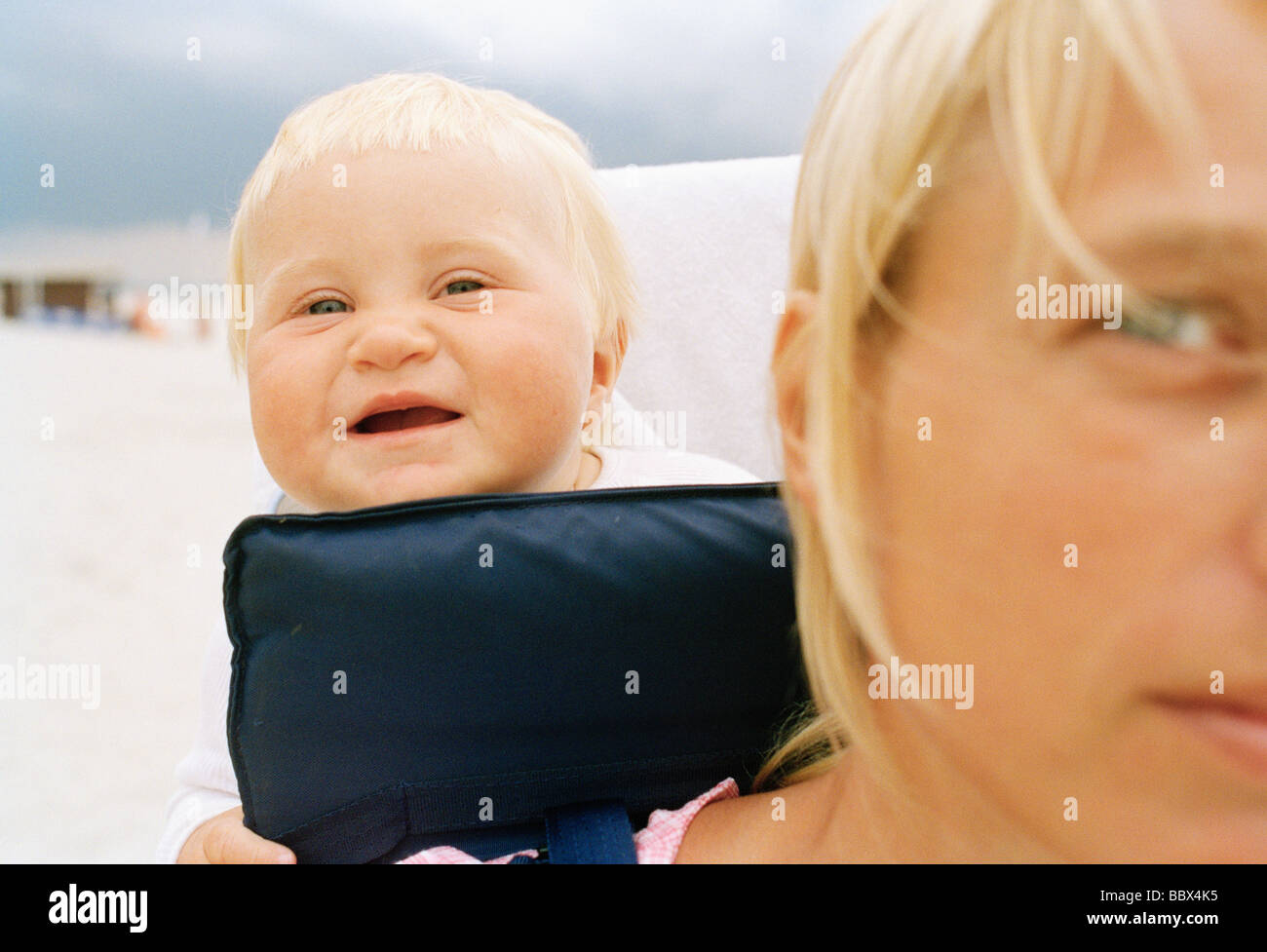 Scandinavian mother carrying her daughter Poland Stock Photo - Alamy