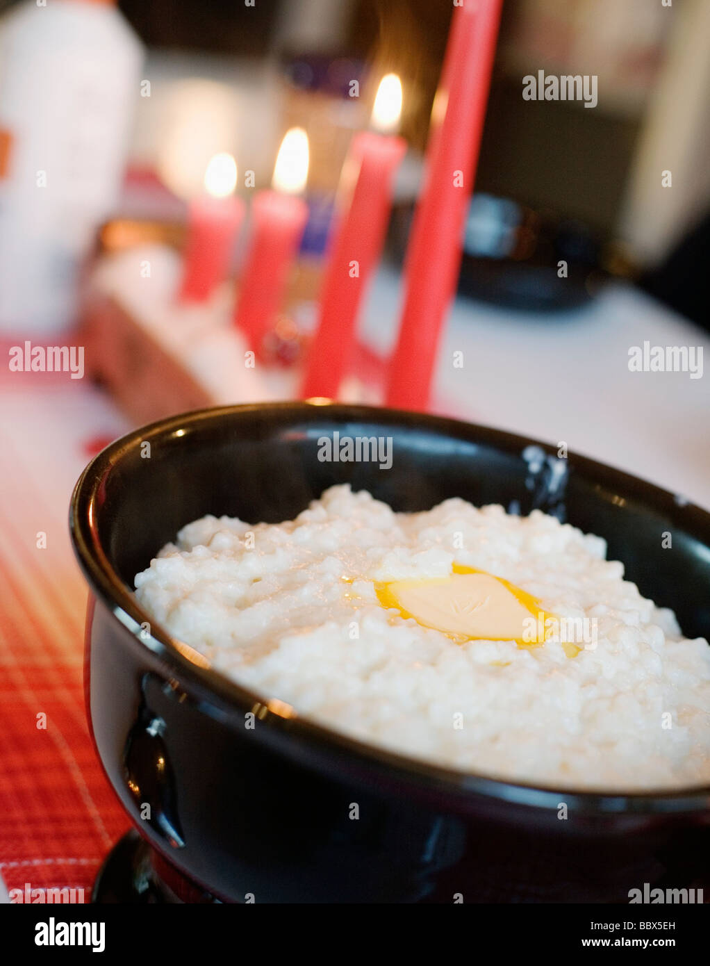 Boiled rice pudding and Advent candlestick Sweden Stock Photo - Alamy