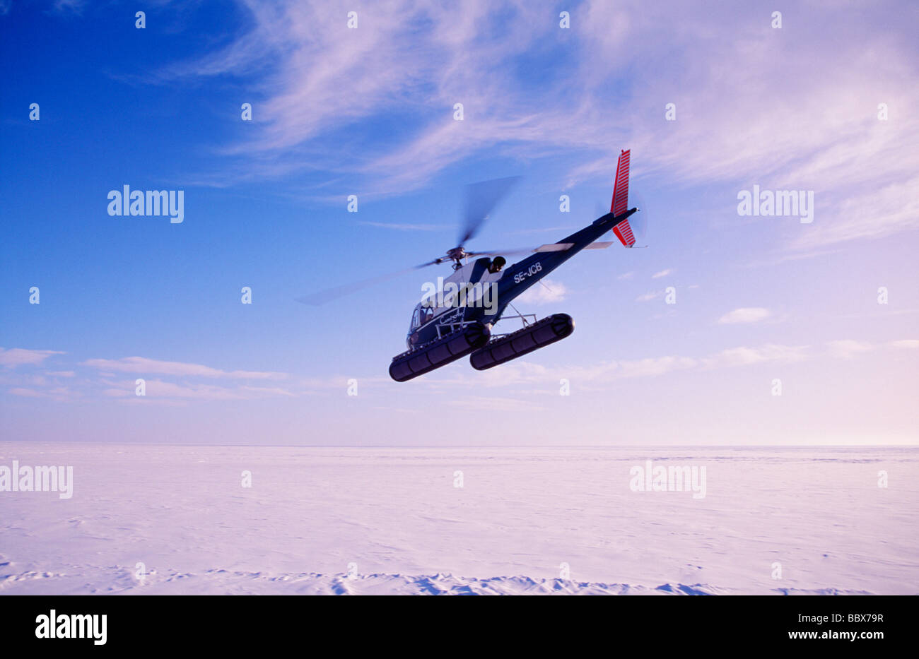 One helicopter flying low over hi-res stock photography and images - Alamy