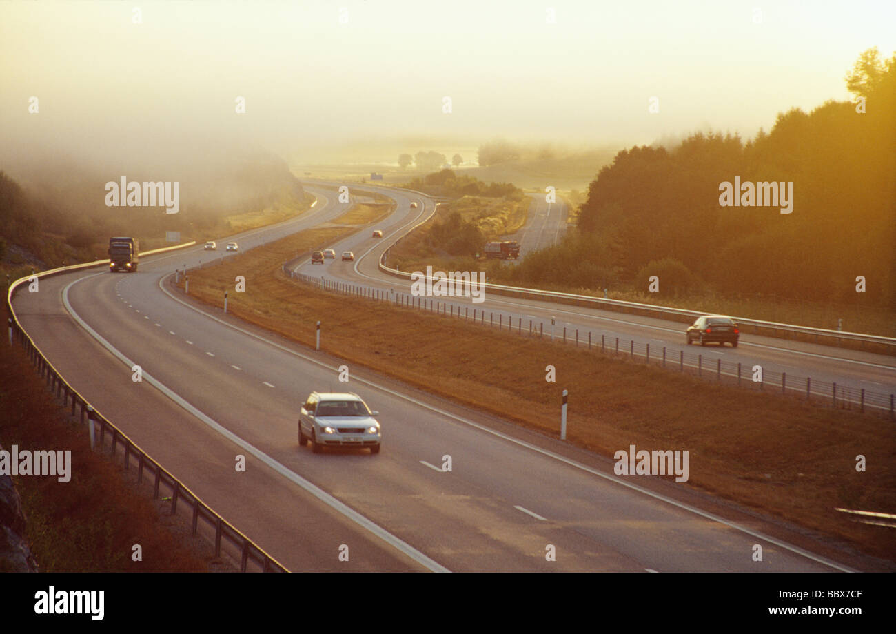 Vehicles moving on road Stock Photo - Alamy