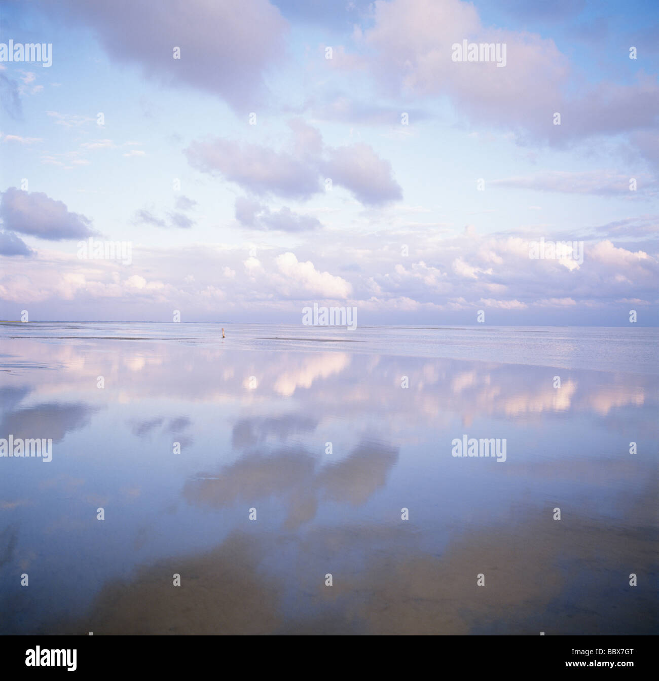 Reflection of sky and clouds on sea Stock Photo - Alamy