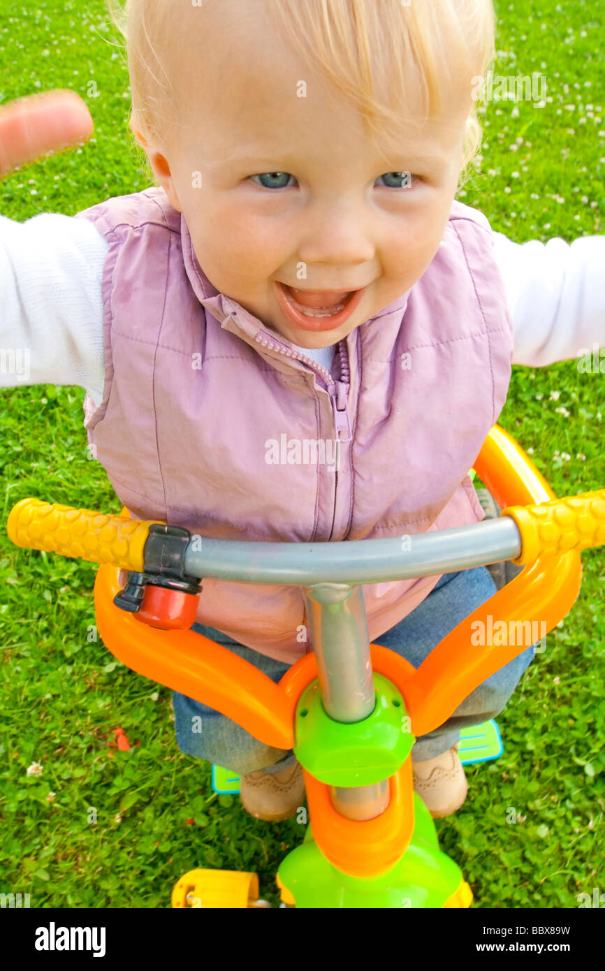 Happy kid on bicycle Stock Photo - Alamy