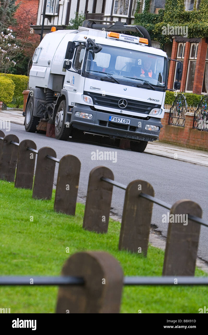 A road cleaning vehicle working in a residential street in the United ...