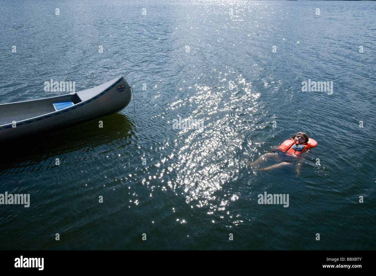 A child overboard and a canoe Sweden Stock Photo - Alamy