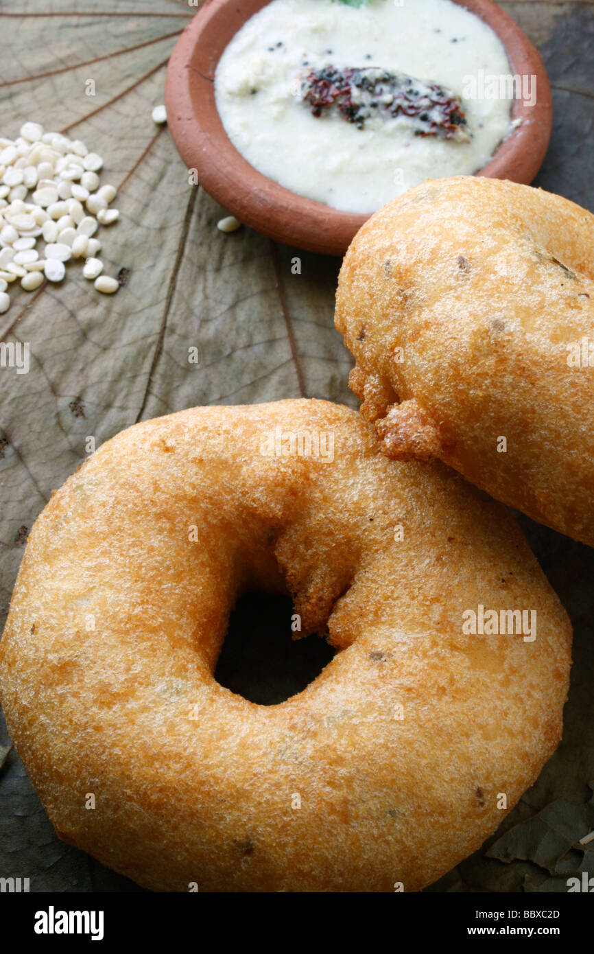 Vada is a South Indian snack shaped like a doughnut and made from dal ...