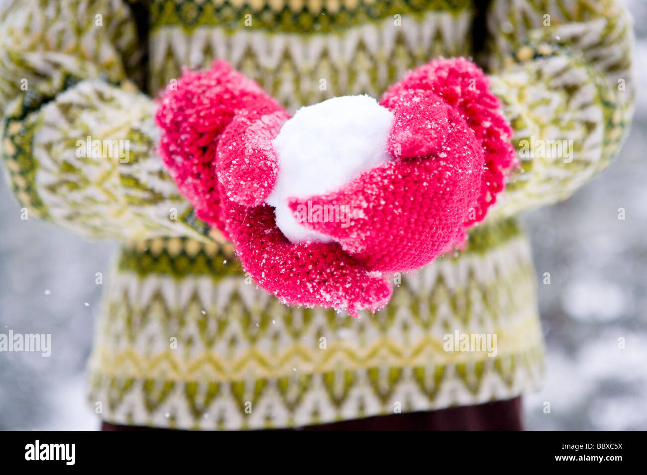 A woman making snowballs Sweden Stock Photo - Alamy