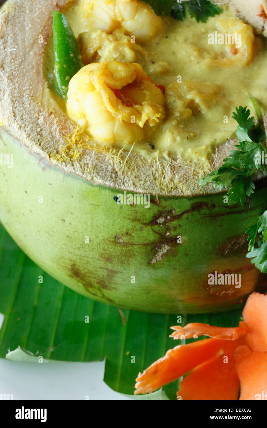 Dab chingri Malai Curry is made of prawns roasted inside a tender ...