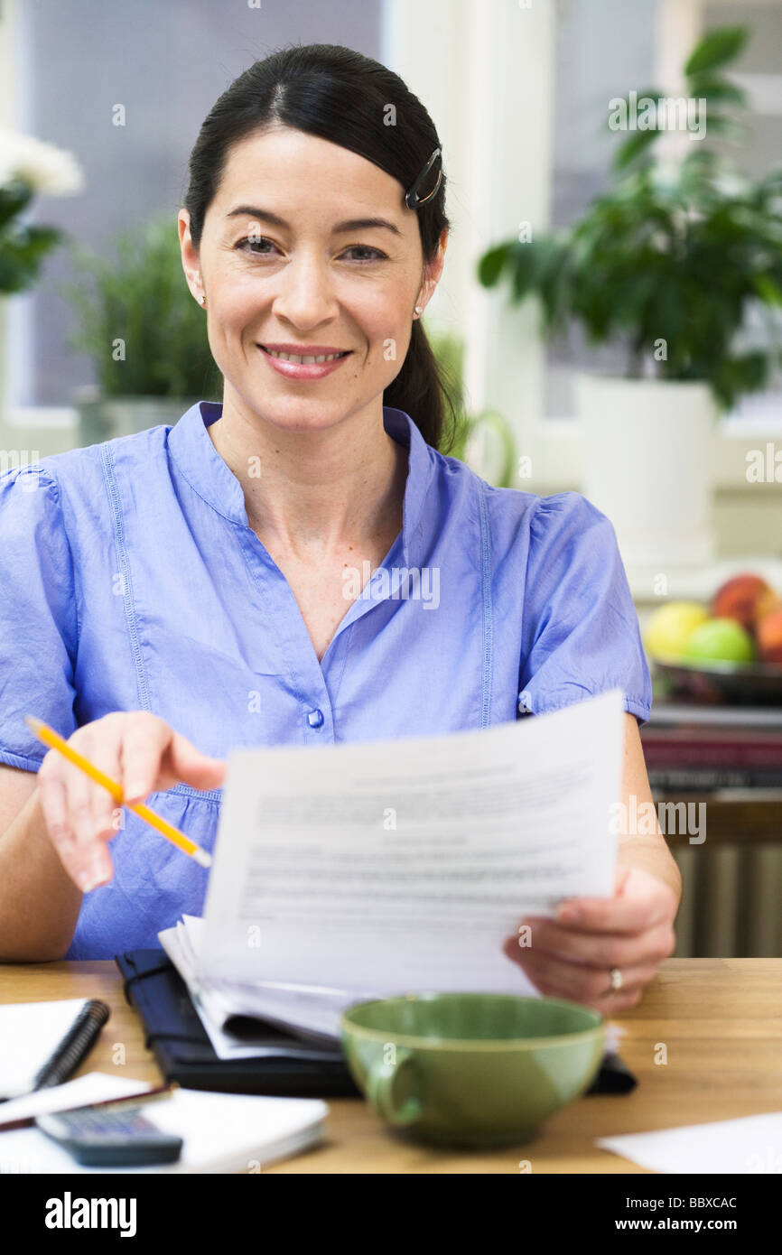 A woman paying bills Stock Photo - Alamy