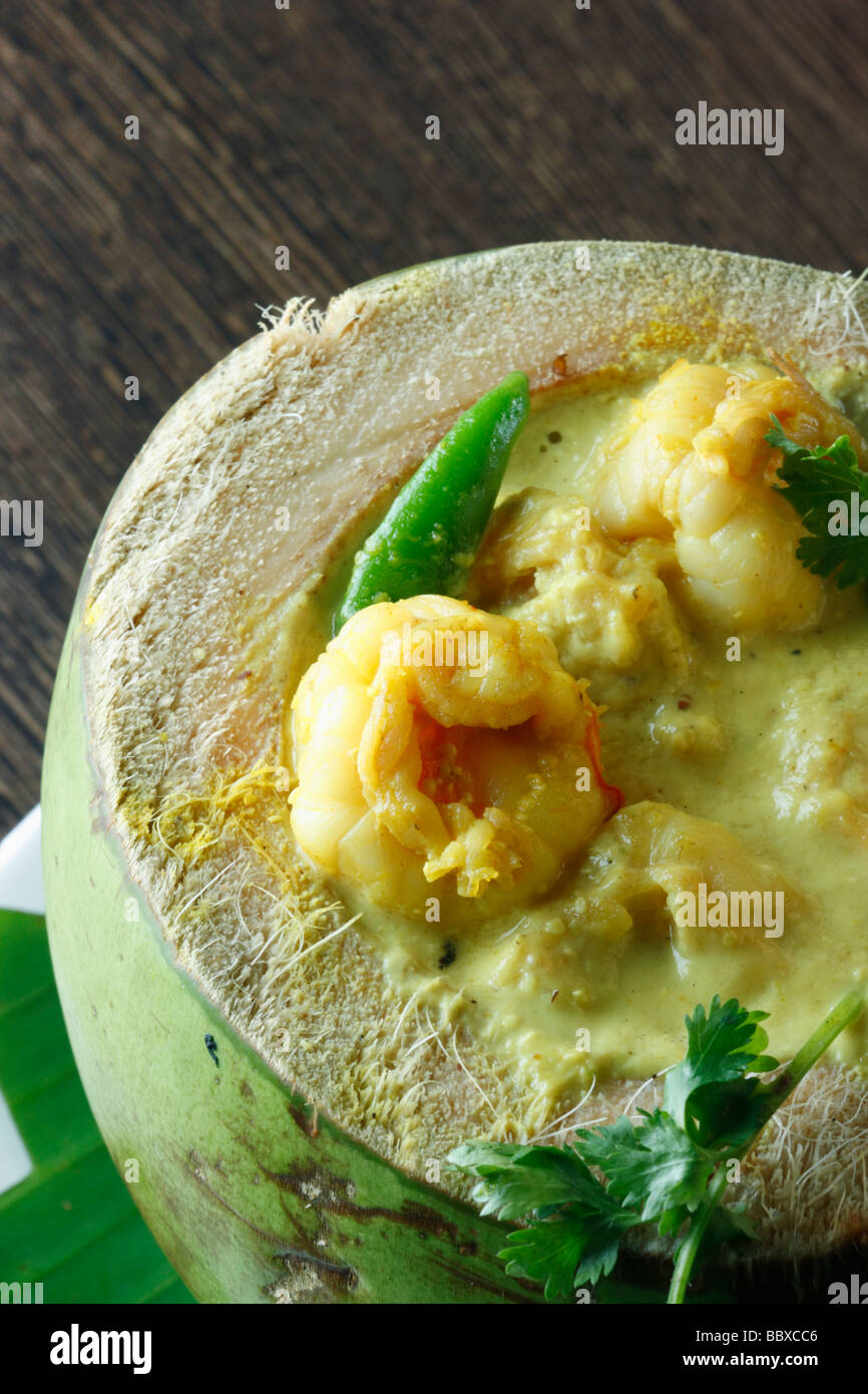 Dab chingri Malai Curry is made of prawns roasted inside a tender ...