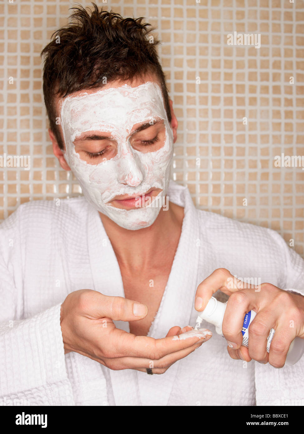 A Scandinavian man using face-cream Stock Photo - Alamy