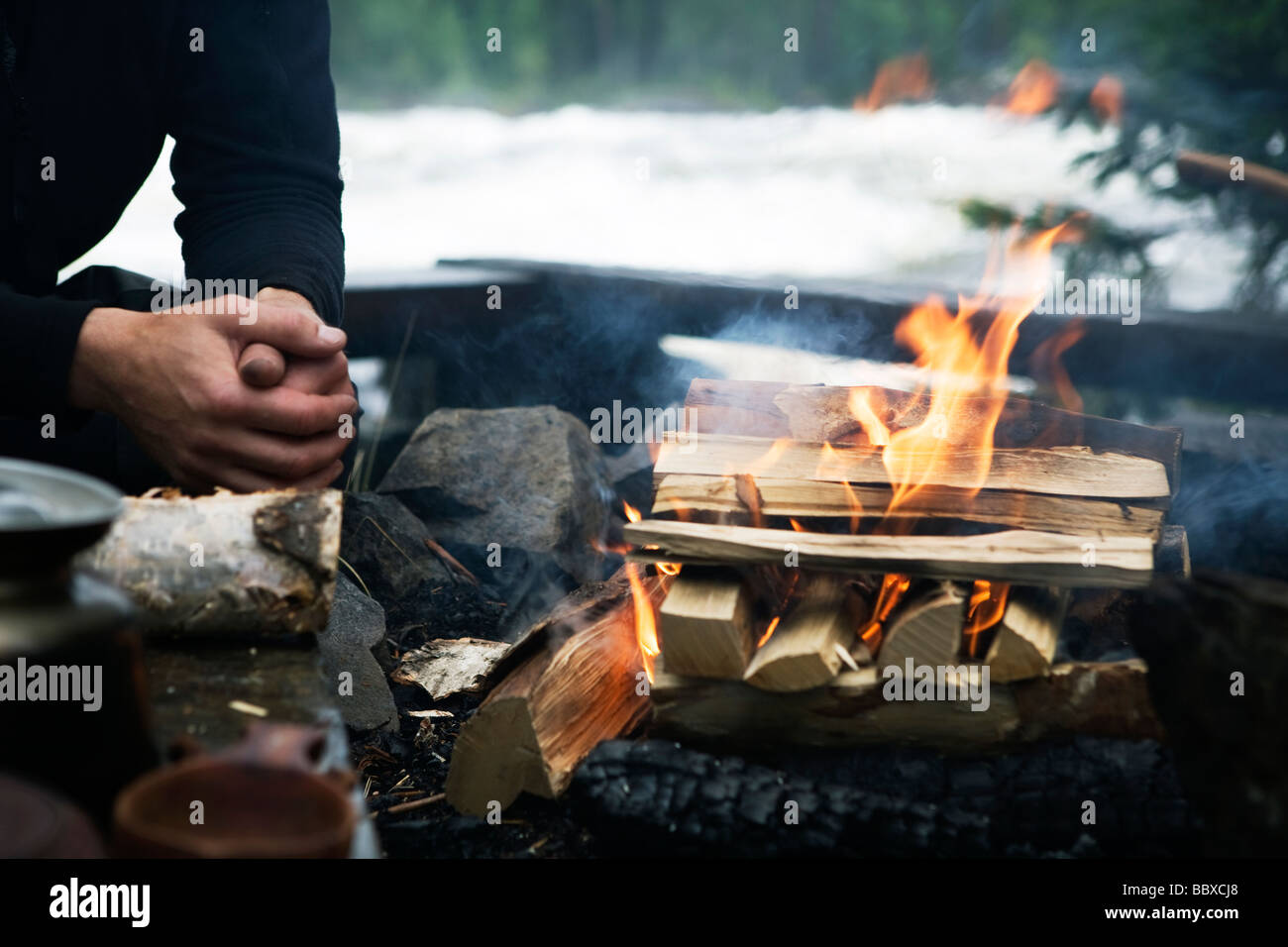 Sitting by the fire outside hi-res stock photography and images - Alamy