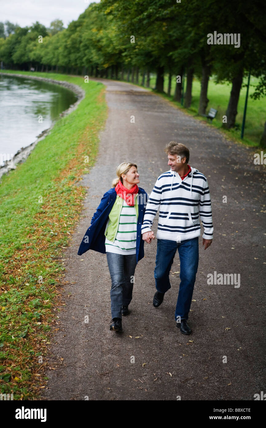 A tender couple strolling in the park Sweden Stock Photo - Alamy