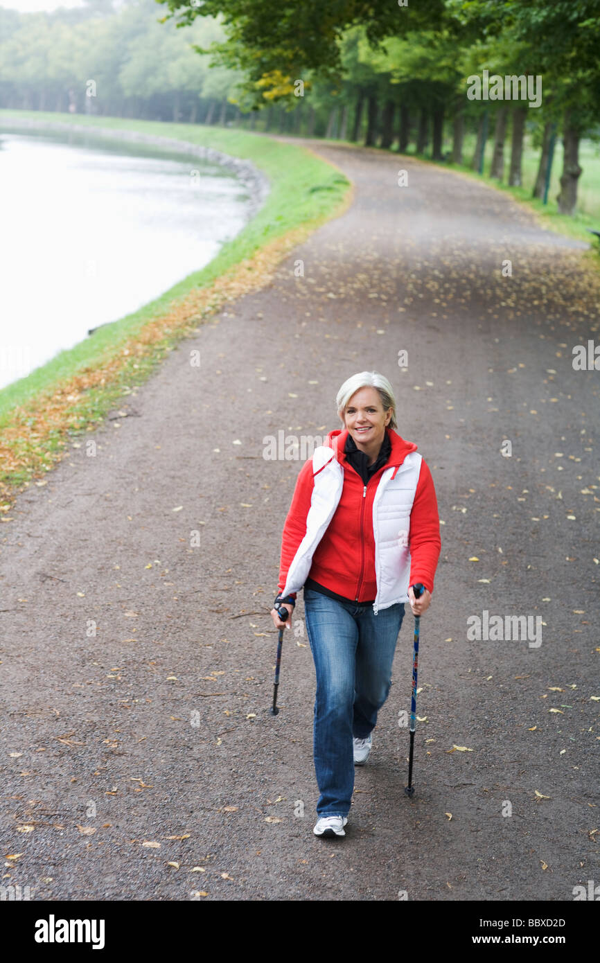 A woman pole walking Sweden Stock Photo - Alamy