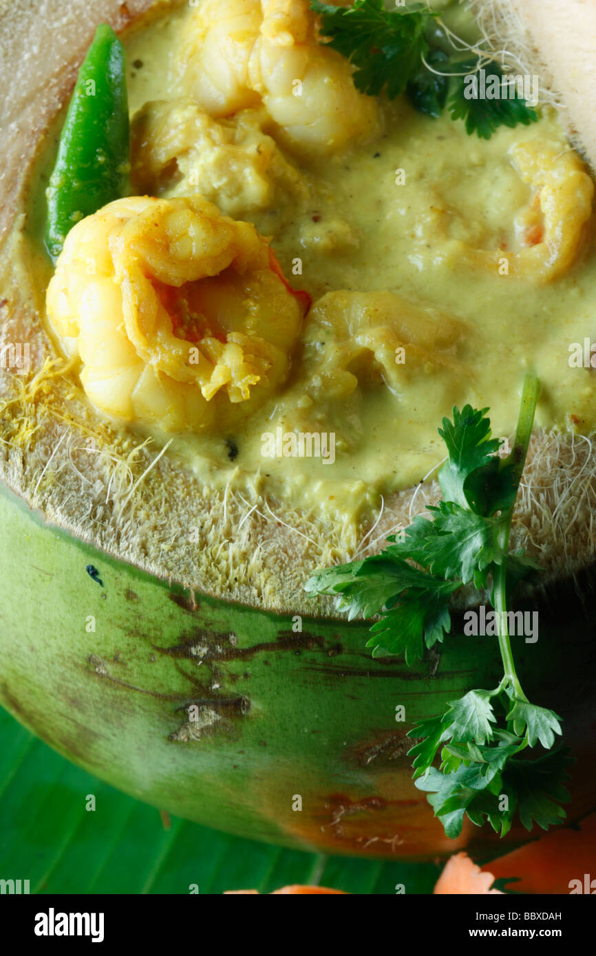 Dab chingri Malai Curry is made of prawns roasted inside a tender ...