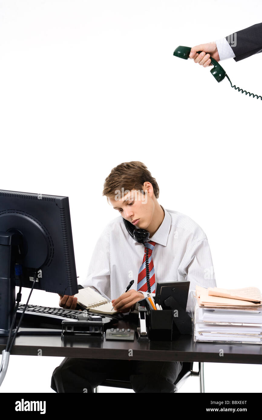 A teenage boy as a businessman at the office Stock Photo - Alamy