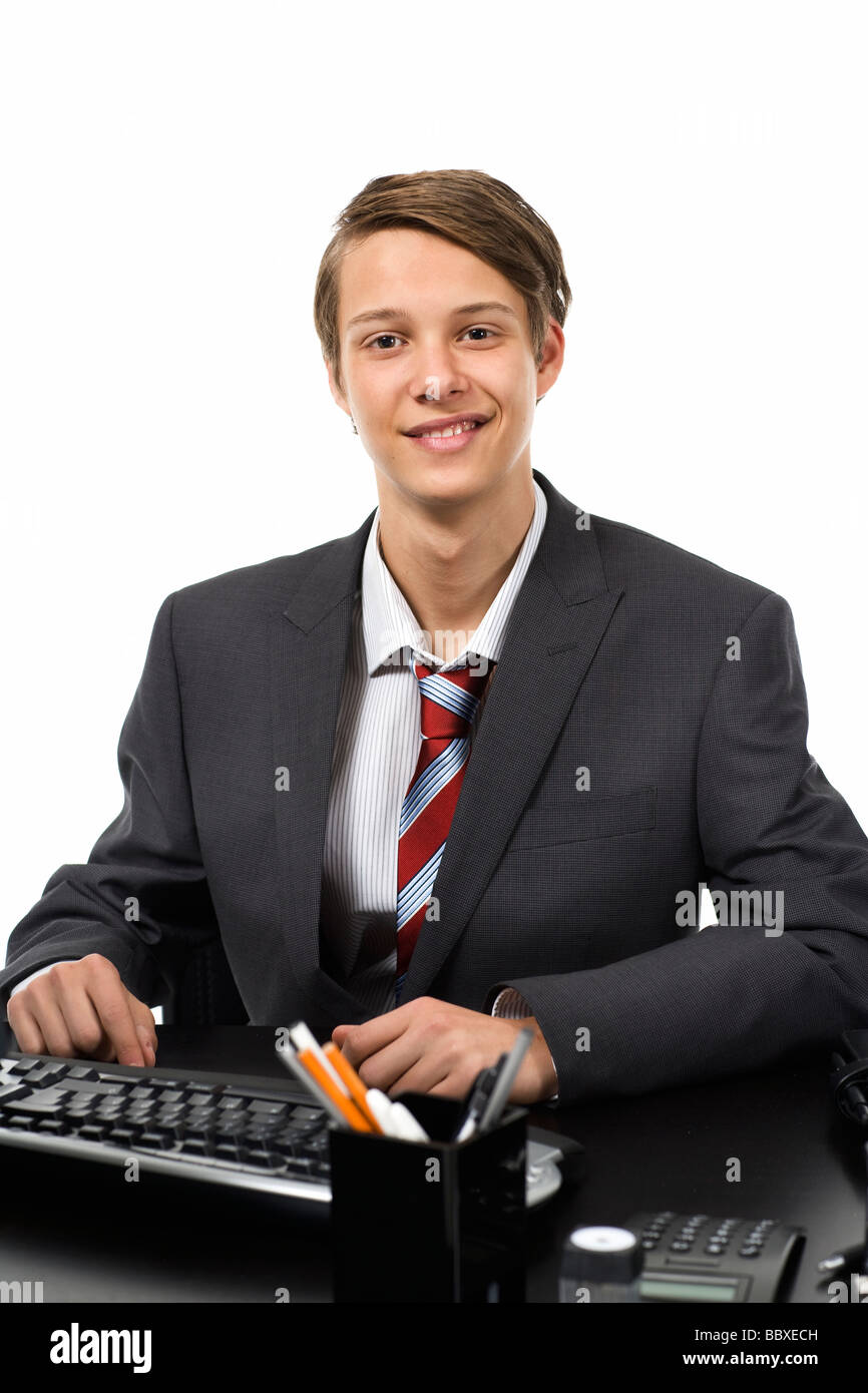 A young boy as a businessman at the office Stock Photo - Alamy