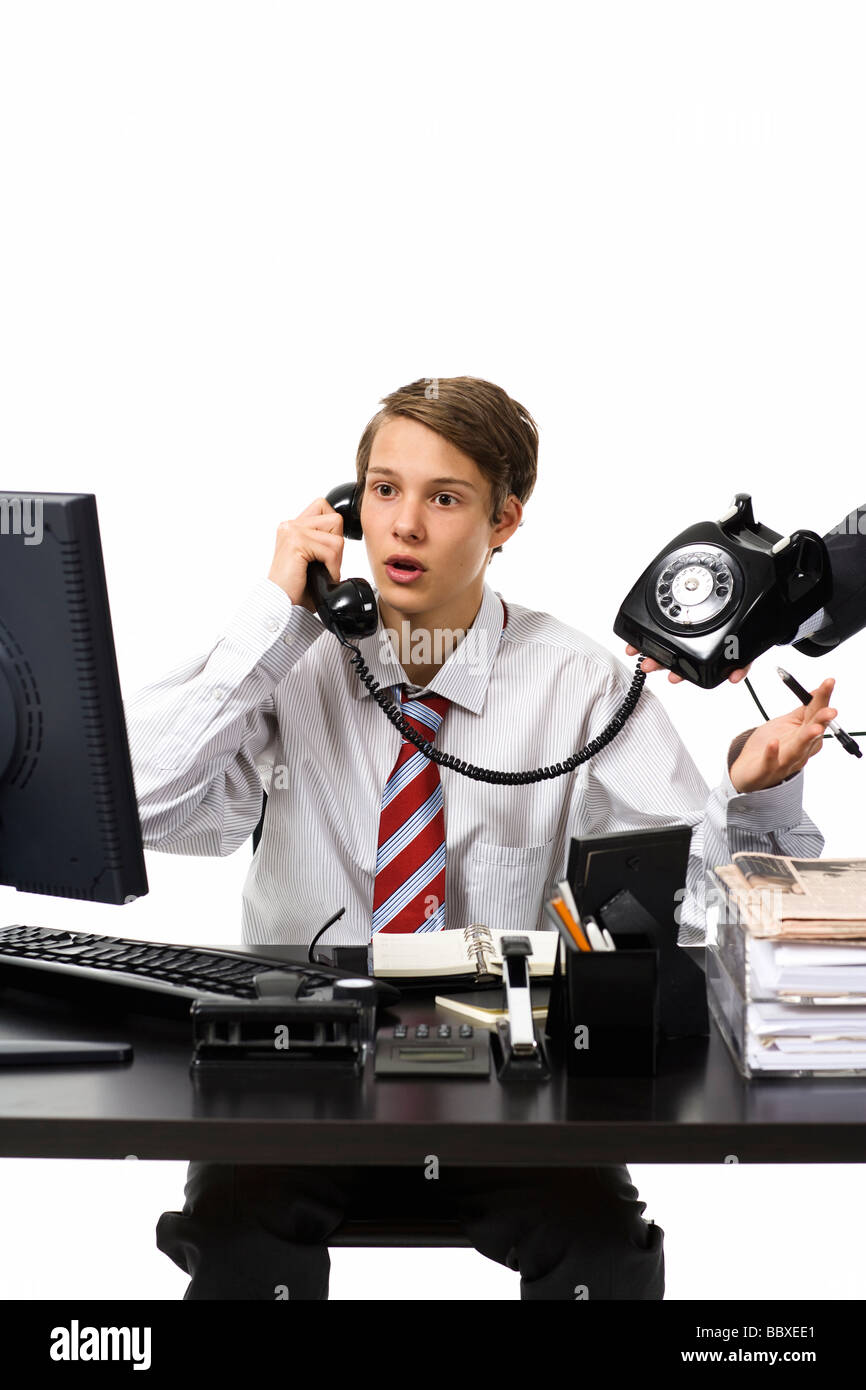 A teenage boy as a businessman at the office Stock Photo - Alamy