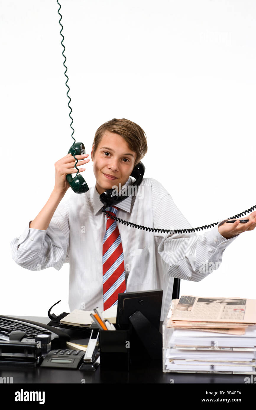 A teenage boy as a businessman at the office Stock Photo - Alamy