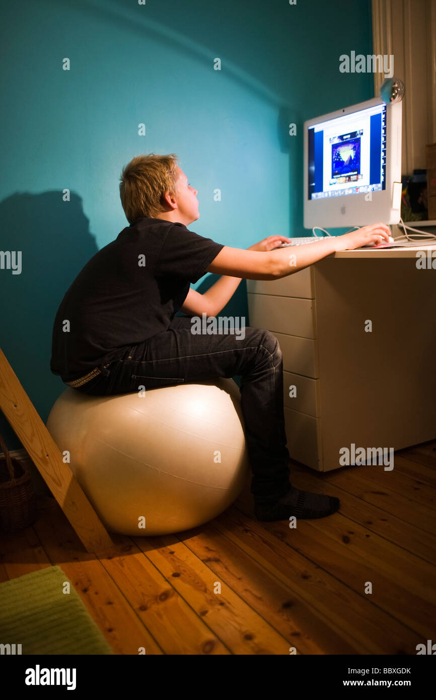 A boy in front of his computer Sweden Stock Photo - Alamy