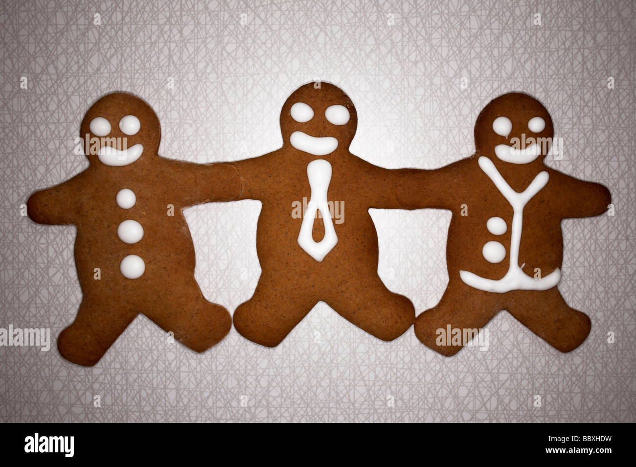 Three gingerbread men hand in hand Denmark Stock Photo - Alamy