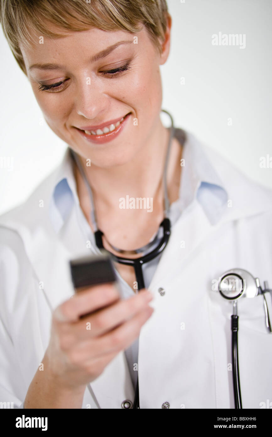 A female doctor using a mobile phone Sweden Stock Photo - Alamy