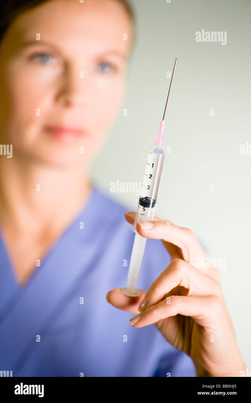 Nurses hands injection in close hi-res stock photography and images - Alamy