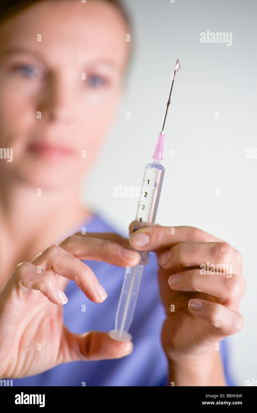 Nurse preparing injection close-up Stock Photo - Alamy