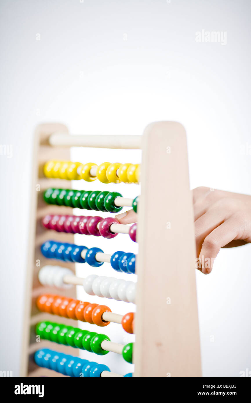 A woman using an abacus Stock Photo - Alamy