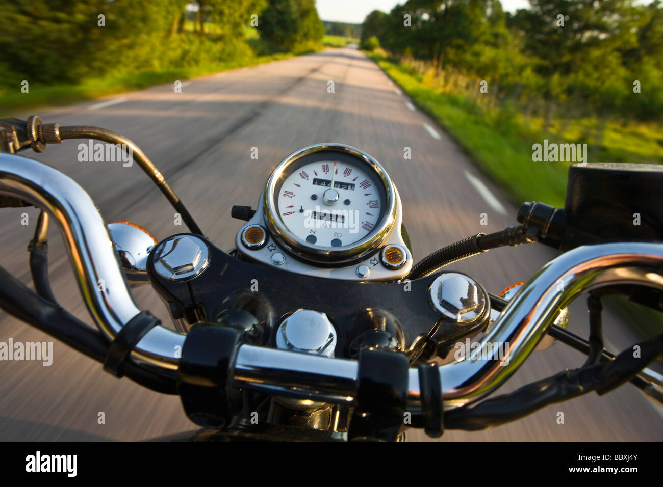 A motorcycle driving on a country road Sweden Stock Photo - Alamy