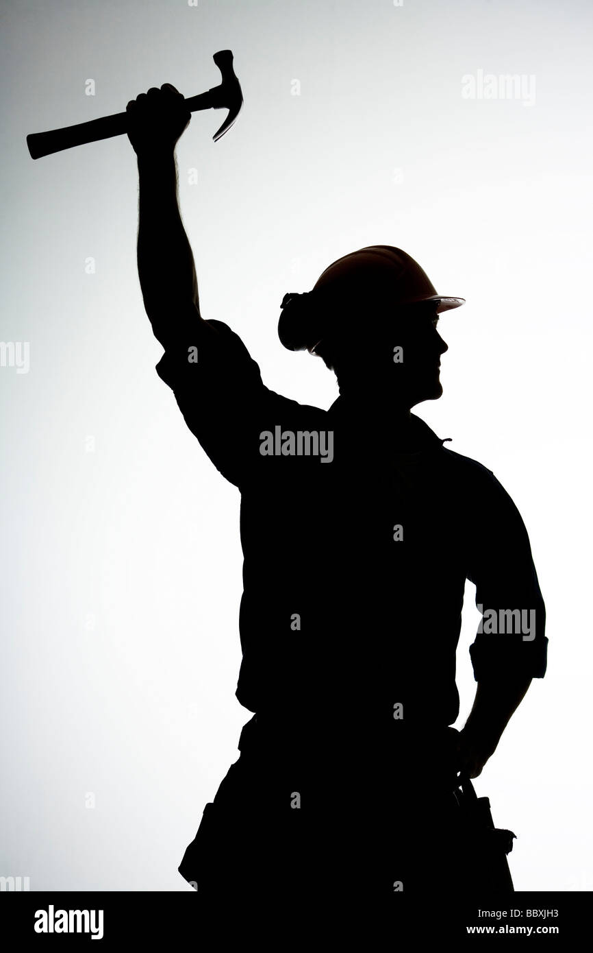 Silhouette of man working with hammer hi-res stock photography and ...