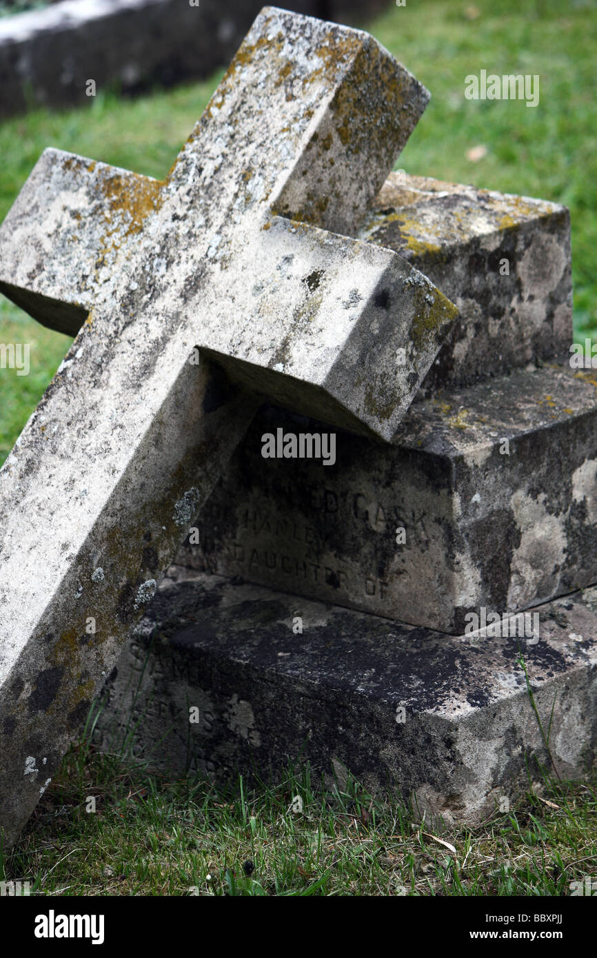 A crucifix gravestone in a church graveyard Stock Photo - Alamy