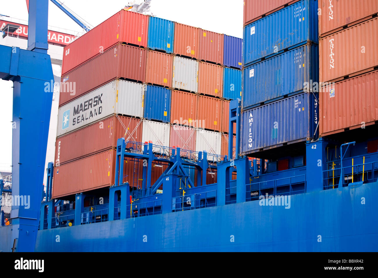 Containers onboard a docked containership await to be unloaded Stock ...