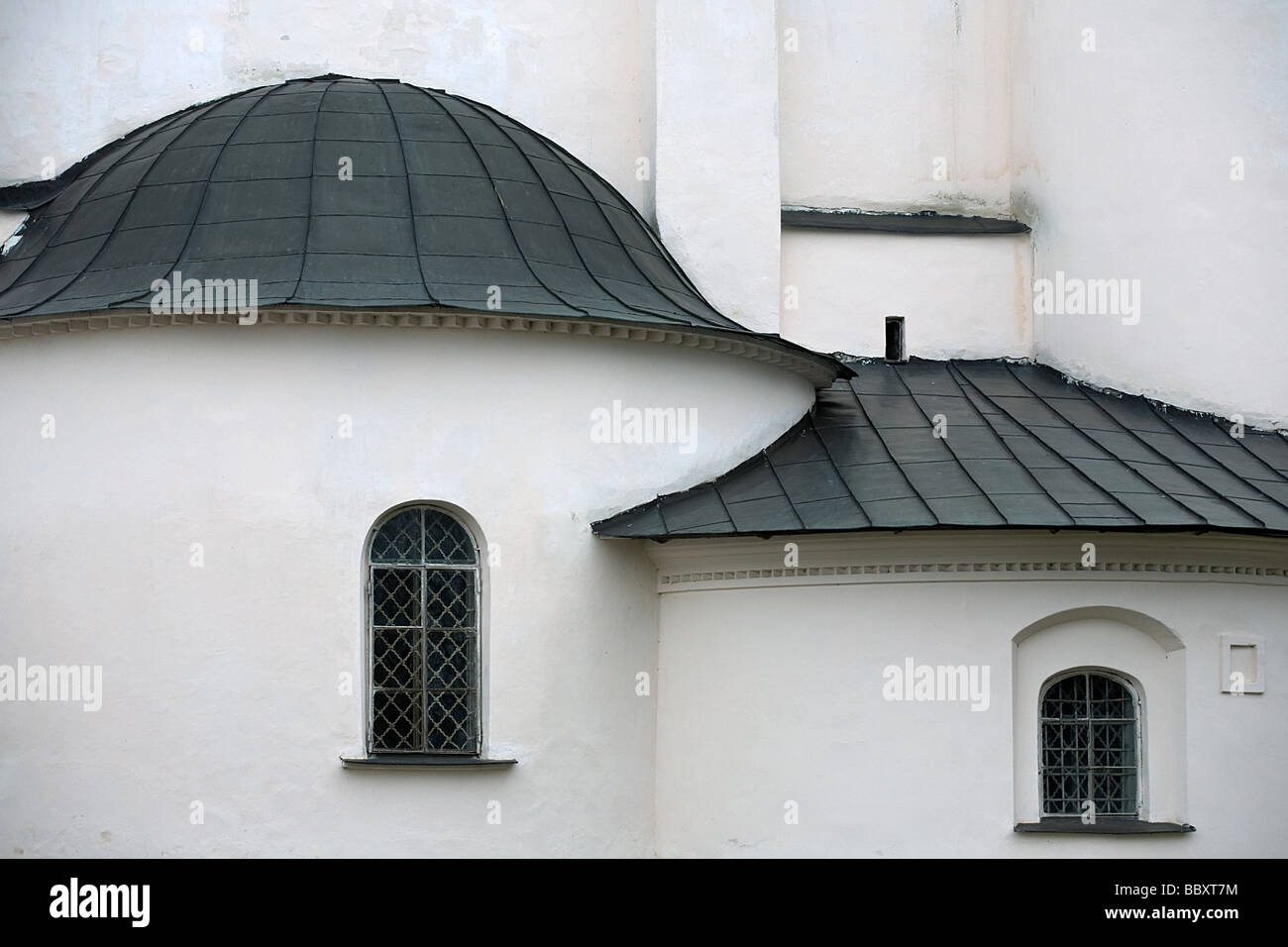 White stone wall of a monastery with windows a close up Stock Photo - Alamy