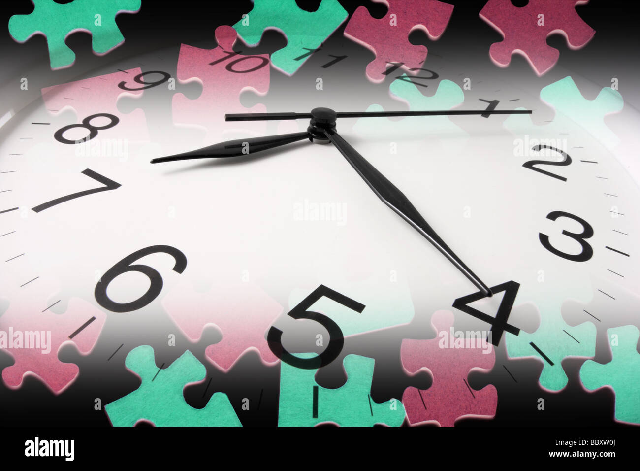 Clock and Jigsaw Puzzle Pieces Stock Photo - Alamy