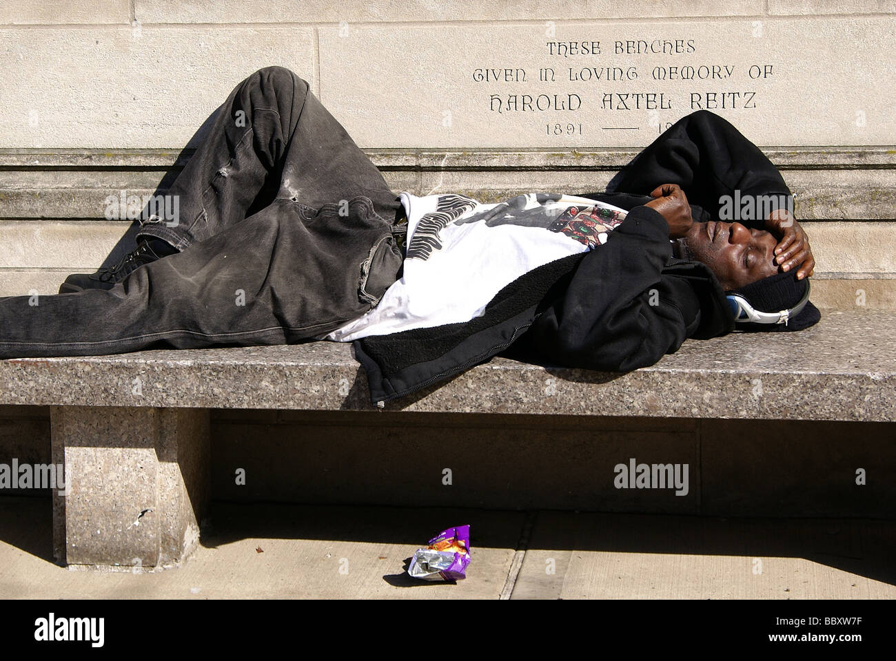 Homeless man sleeps in front of a church in Manhattan Stock Photo - Alamy