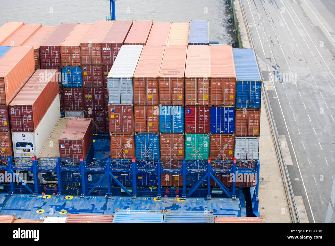 Containers onboard a docked containership await to be unloaded Stock ...