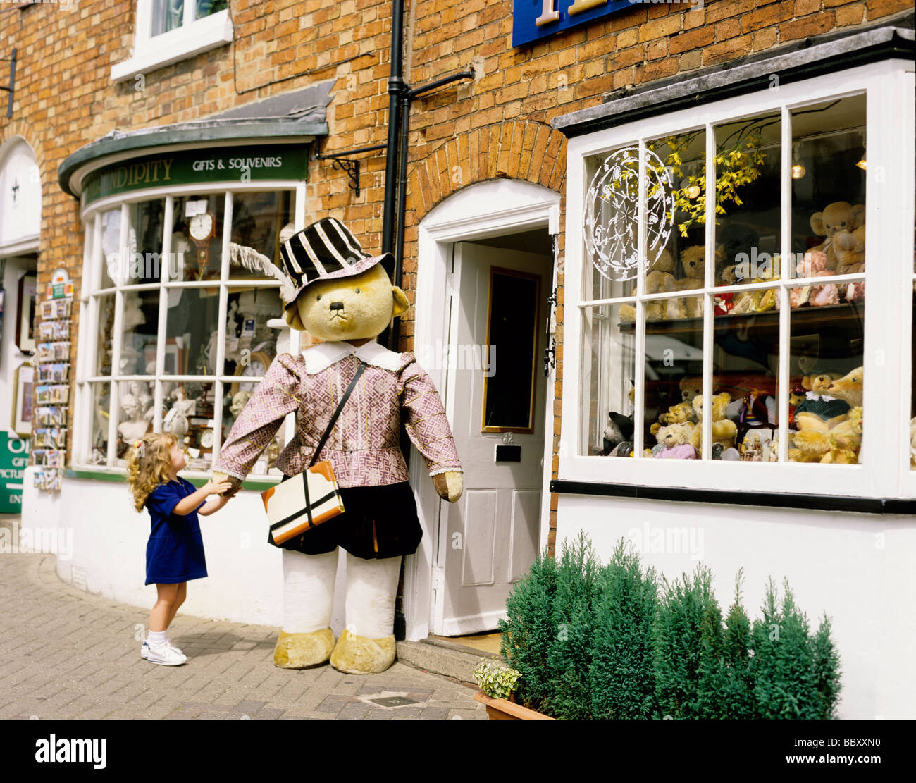 England, Stratford-upon-avon, Teddy Bear shop, little girl with giant ...